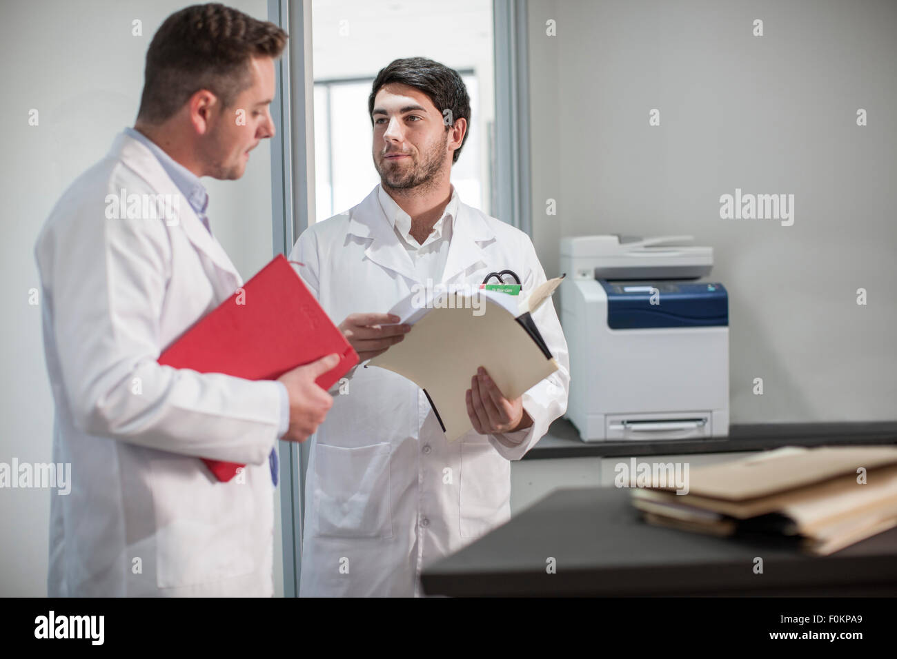Two doctors discussing in clinic Stock Photo - Alamy