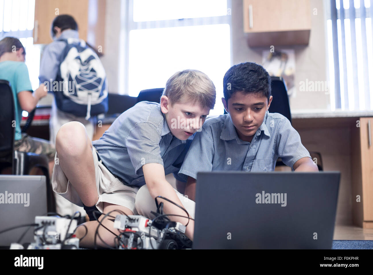 Schoolboys with laptop in robotics class Stock Photo - Alamy
