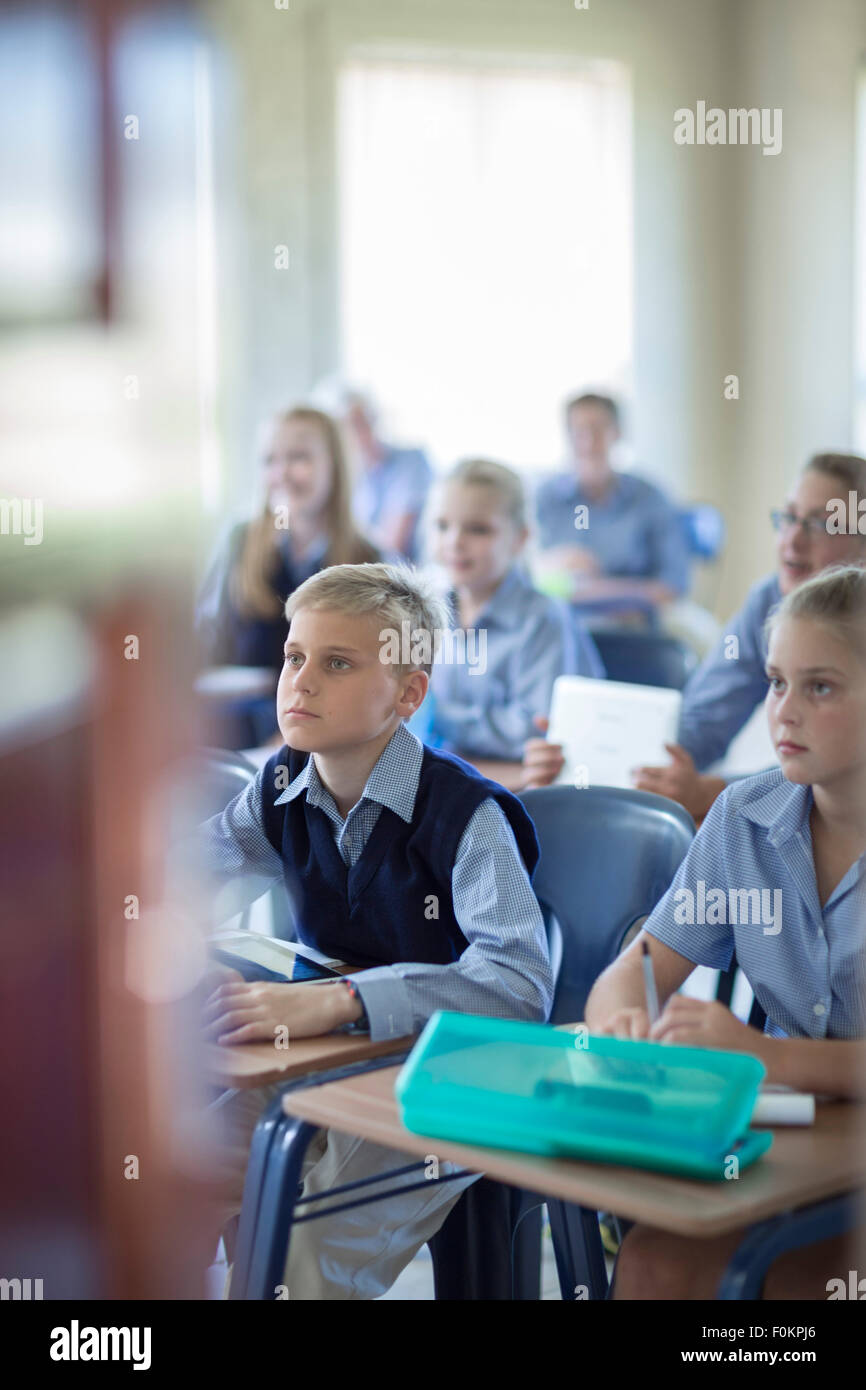 Attentive pupils in classroom Stock Photo - Alamy