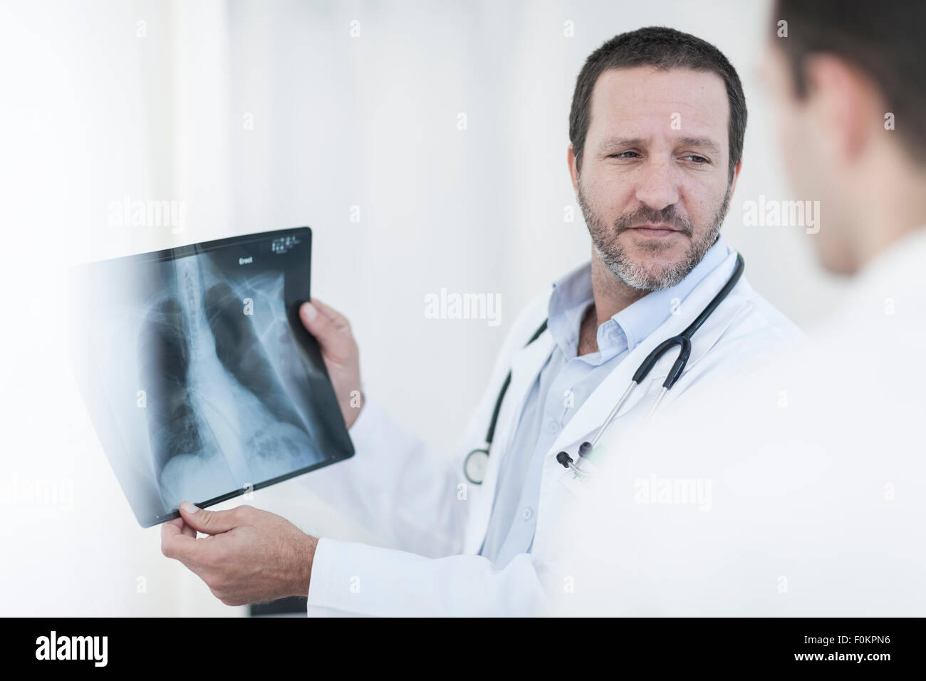 Doctors with x-ray image in a hospital Stock Photo - Alamy