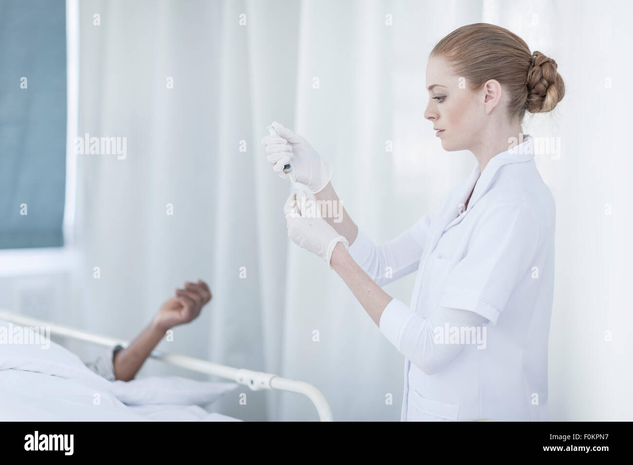 Nurse with injection in a hospital Stock Photo - Alamy