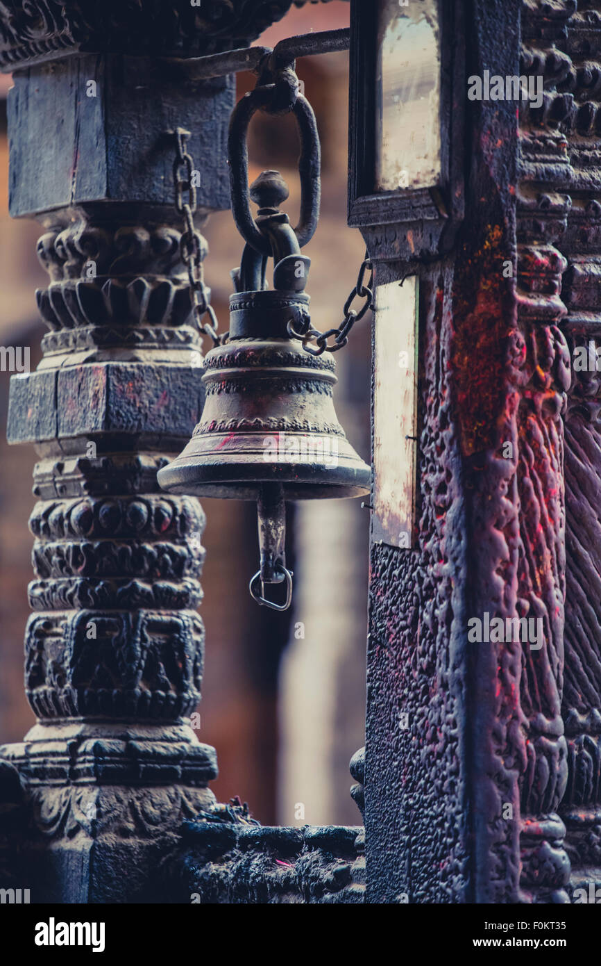 Traditional Nepalese bell in a very old and small temple in Bhaktapur ...