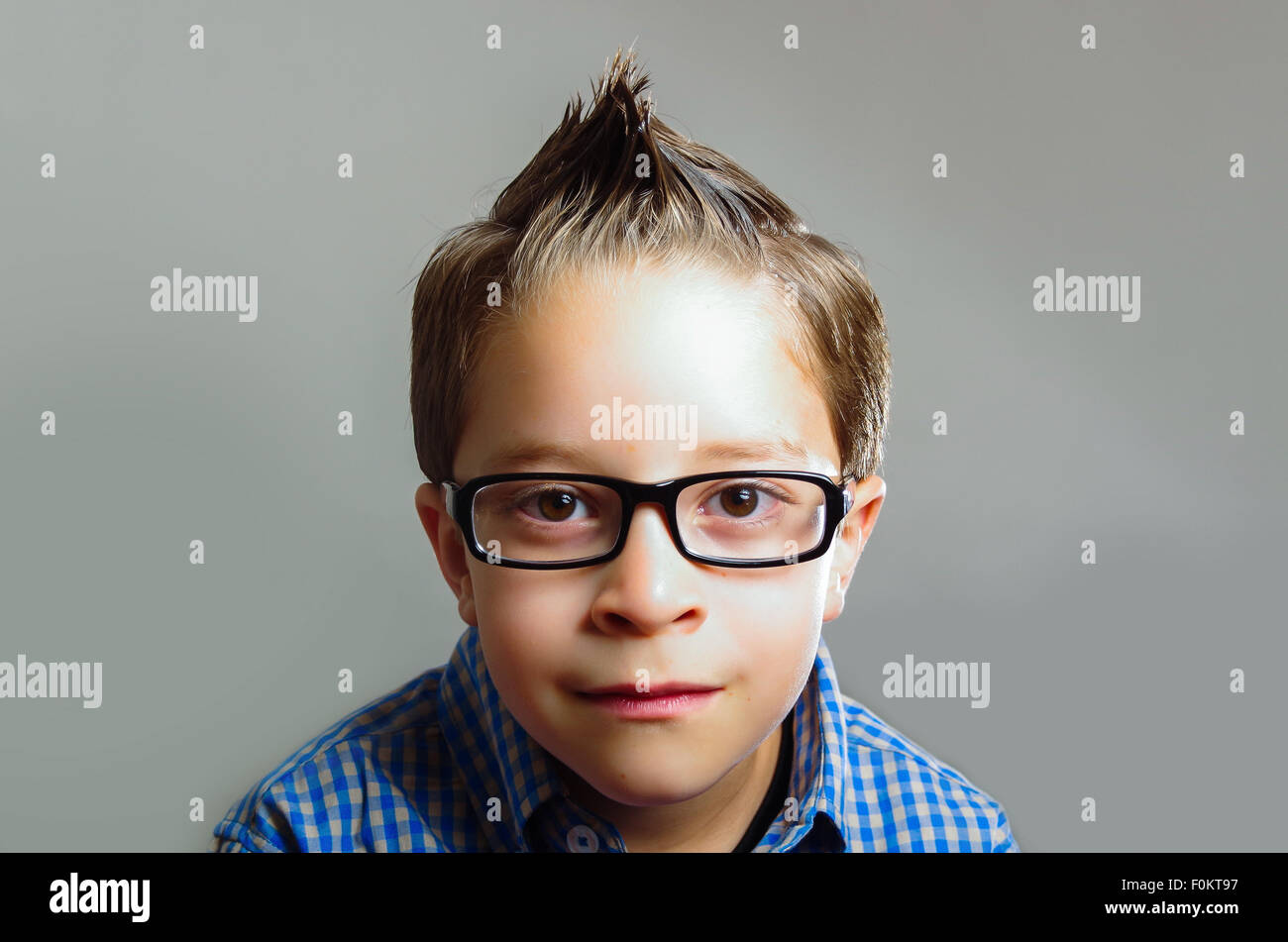 closeup portrait of cute boy wearing glasses Stock Photo - Alamy