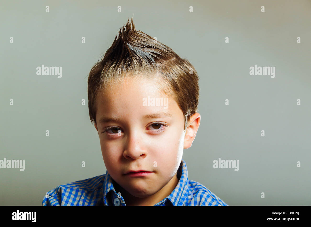 Sweet little boy looking sad Stock Photo - Alamy