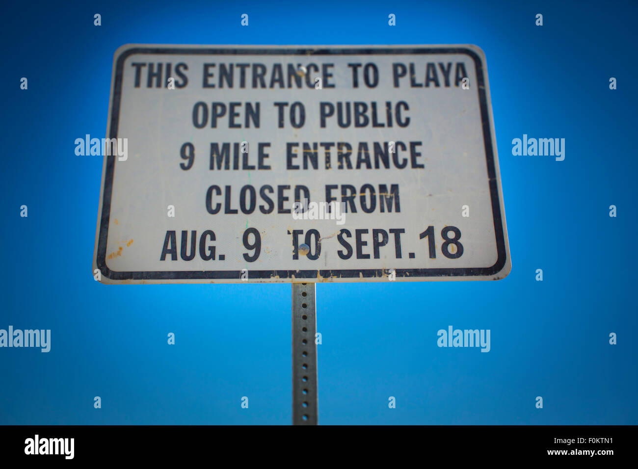 Road sign against a blue sky at the entrance of la Playa in the Black ...