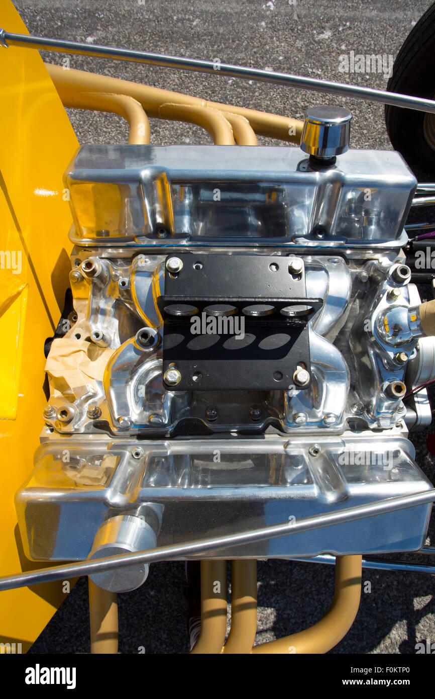 A hotrod engine with a supercharger and multiple air intakes mounted on ...