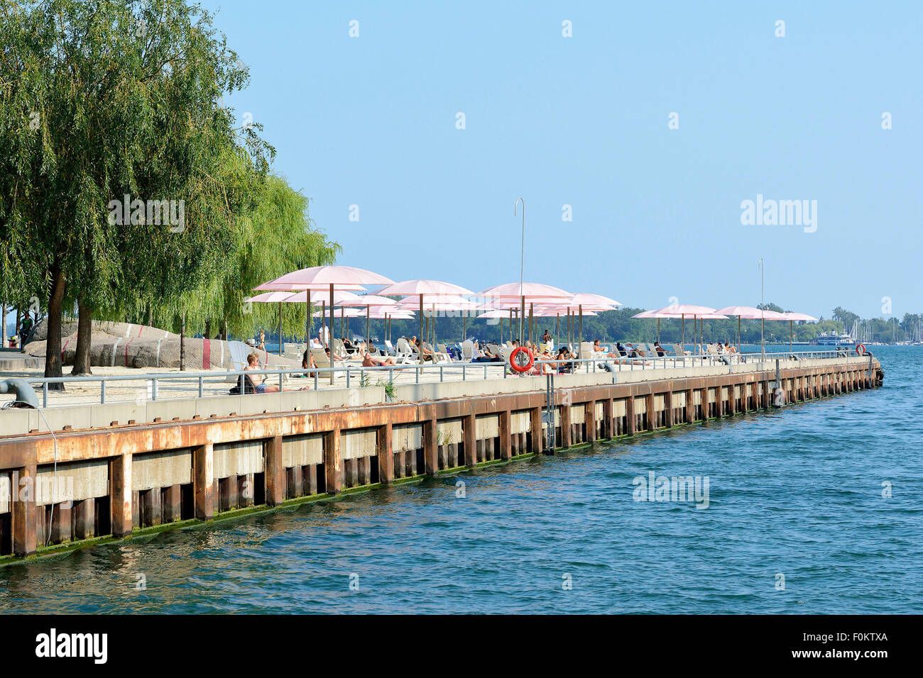 Toronto, Canada. 17th August 2015. People sun bathing at Sugar Beach in ...