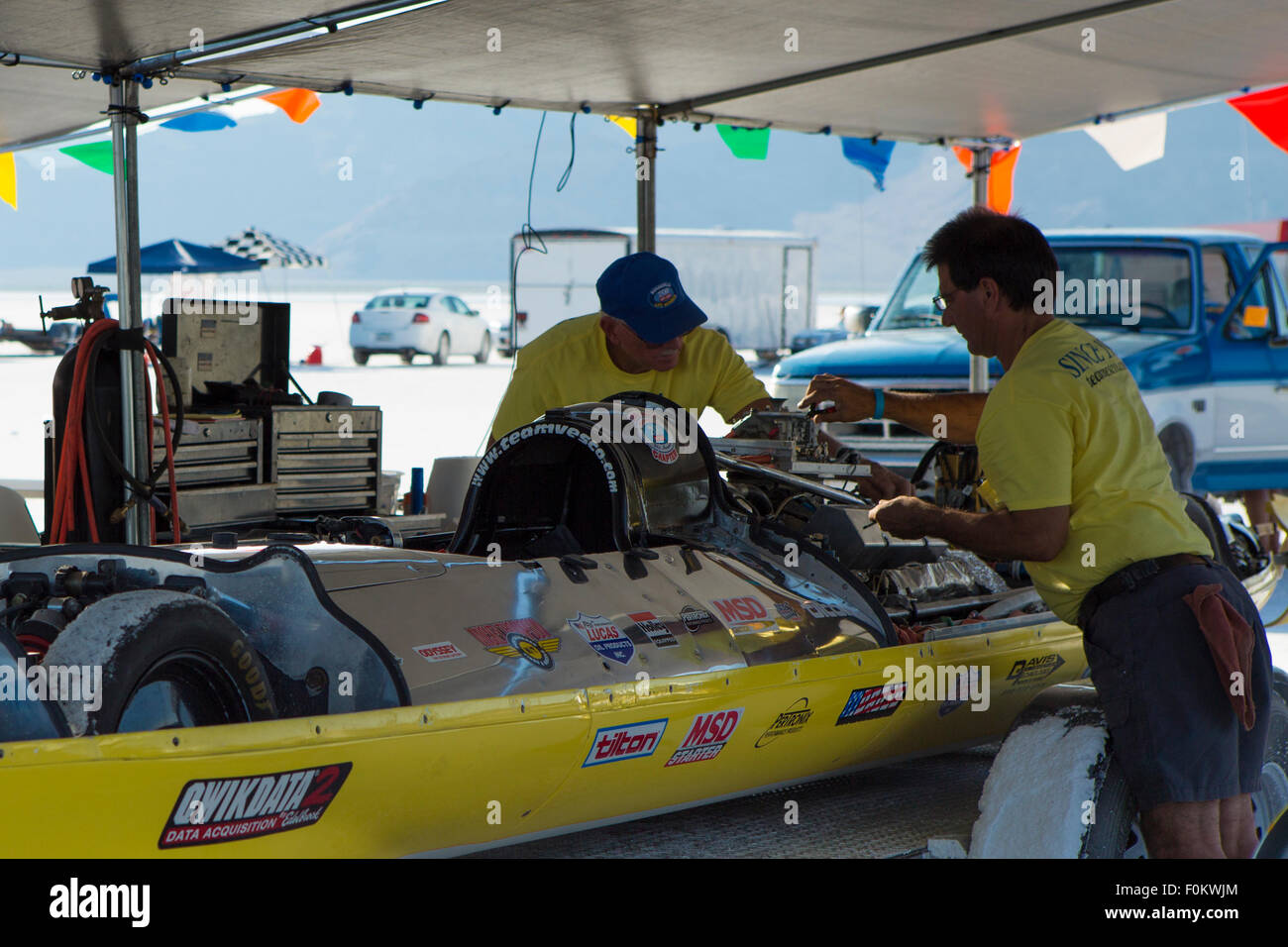 Vesco crew members working on their famous yellow racing car during the ...