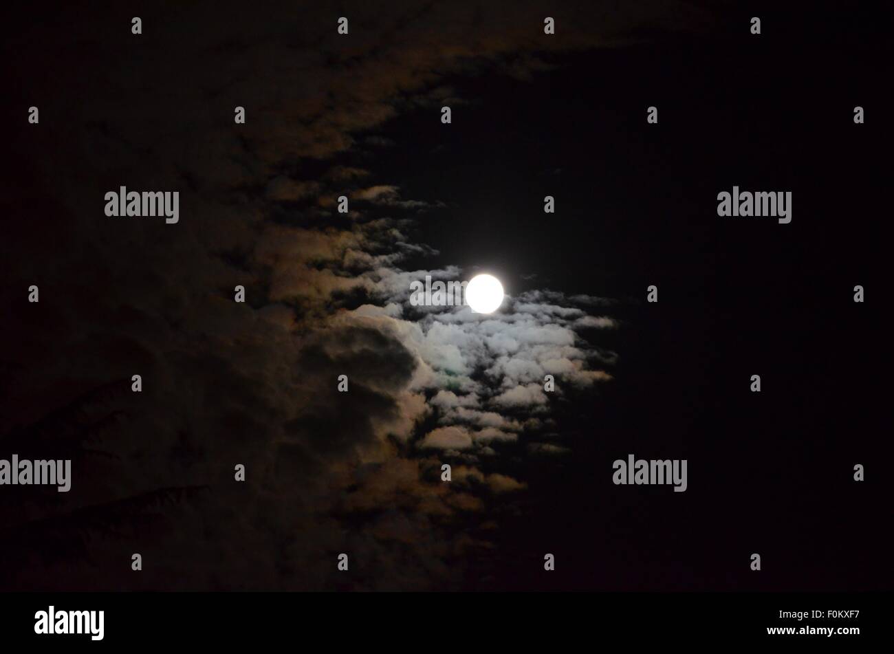 The moon emerges from behind ominous clouds over Vancouver, British ...