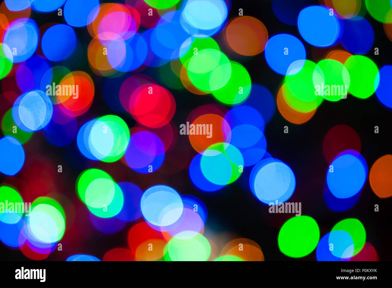 A bright multicolor bokeh background created by a set of de-focused ...