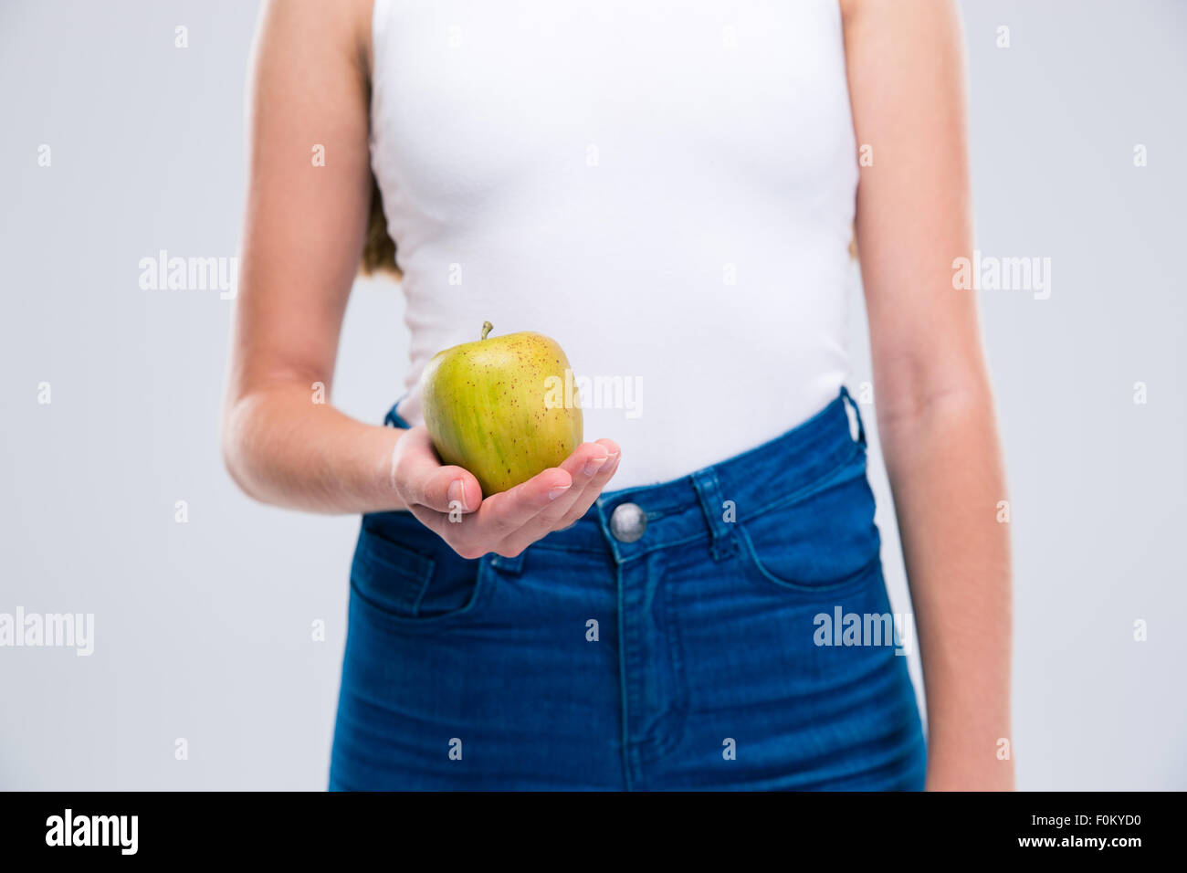 Closeup portrait of a girl holding apple Stock Photo - Alamy
