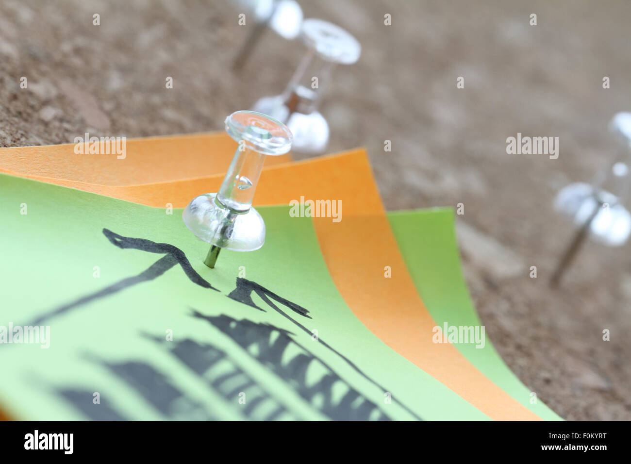 close up of pin and hand drawn business strategy graph chart on sticky ...