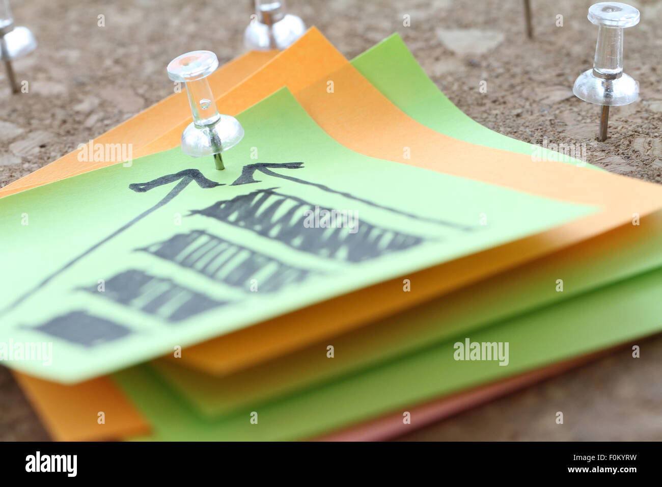 close up of pin and hand drawn business strategy graph chart on sticky ...