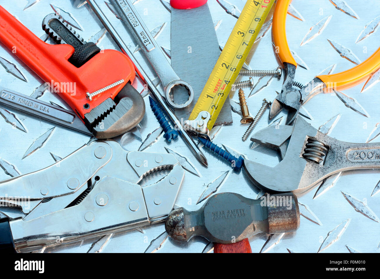 Collection of tools over a steel plate Stock Photo - Alamy