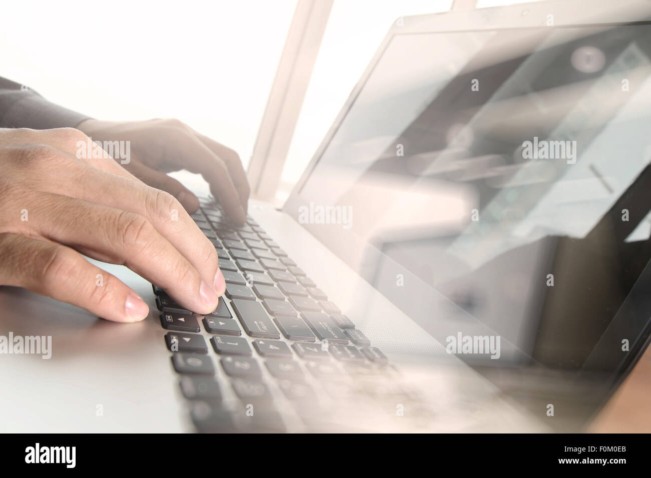 Close up of business man hand working on laptop computer with social ...