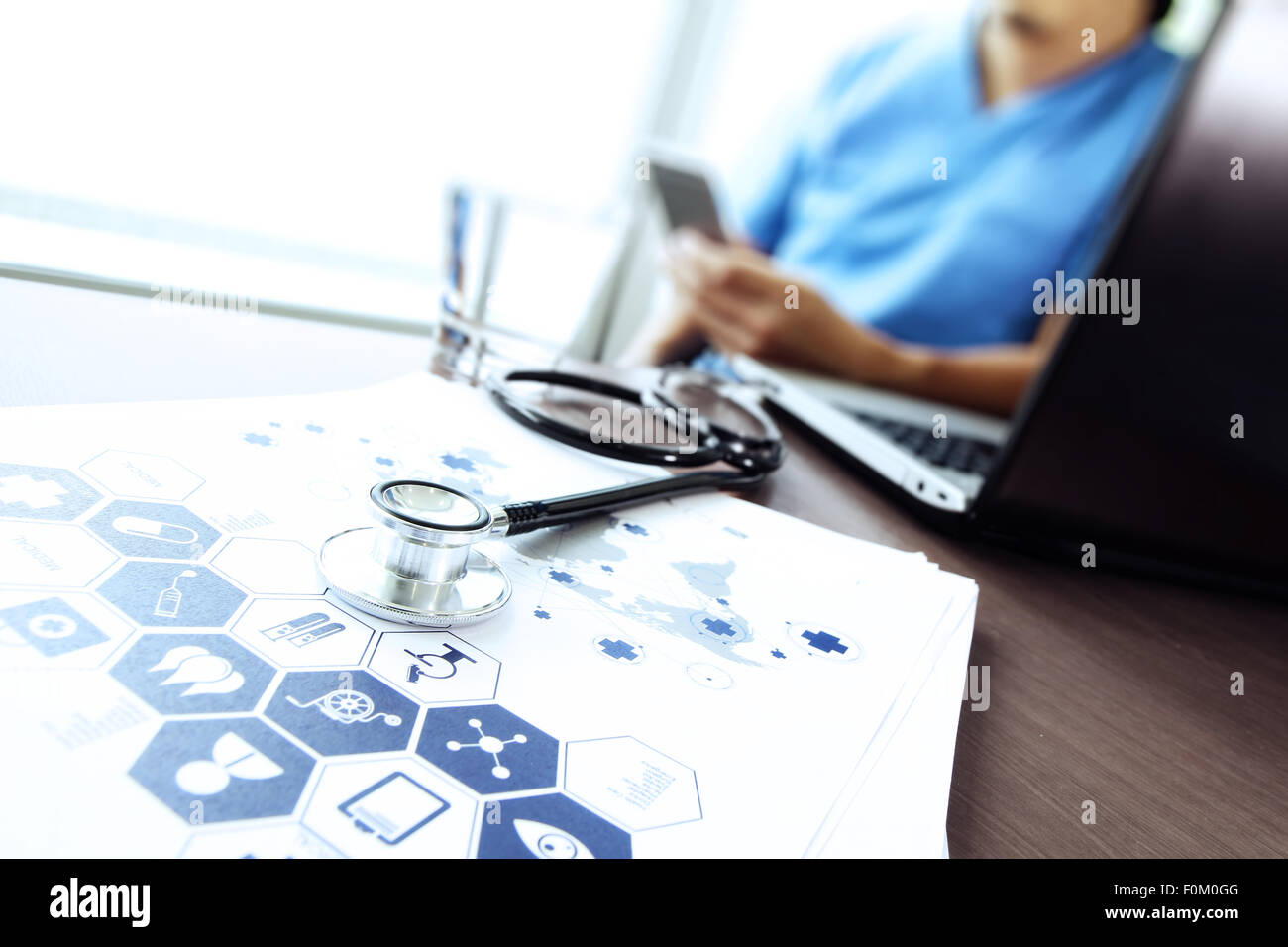 Doctor working with laptop computer in medical workspace office and ...