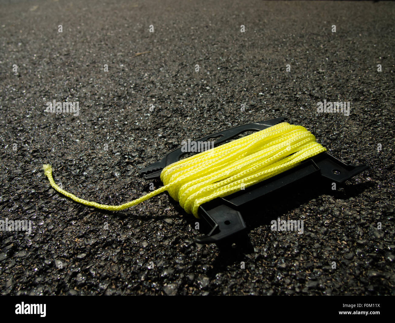 The Yellow String on the Ground at the Constructionsite Stock Photo - Alamy
