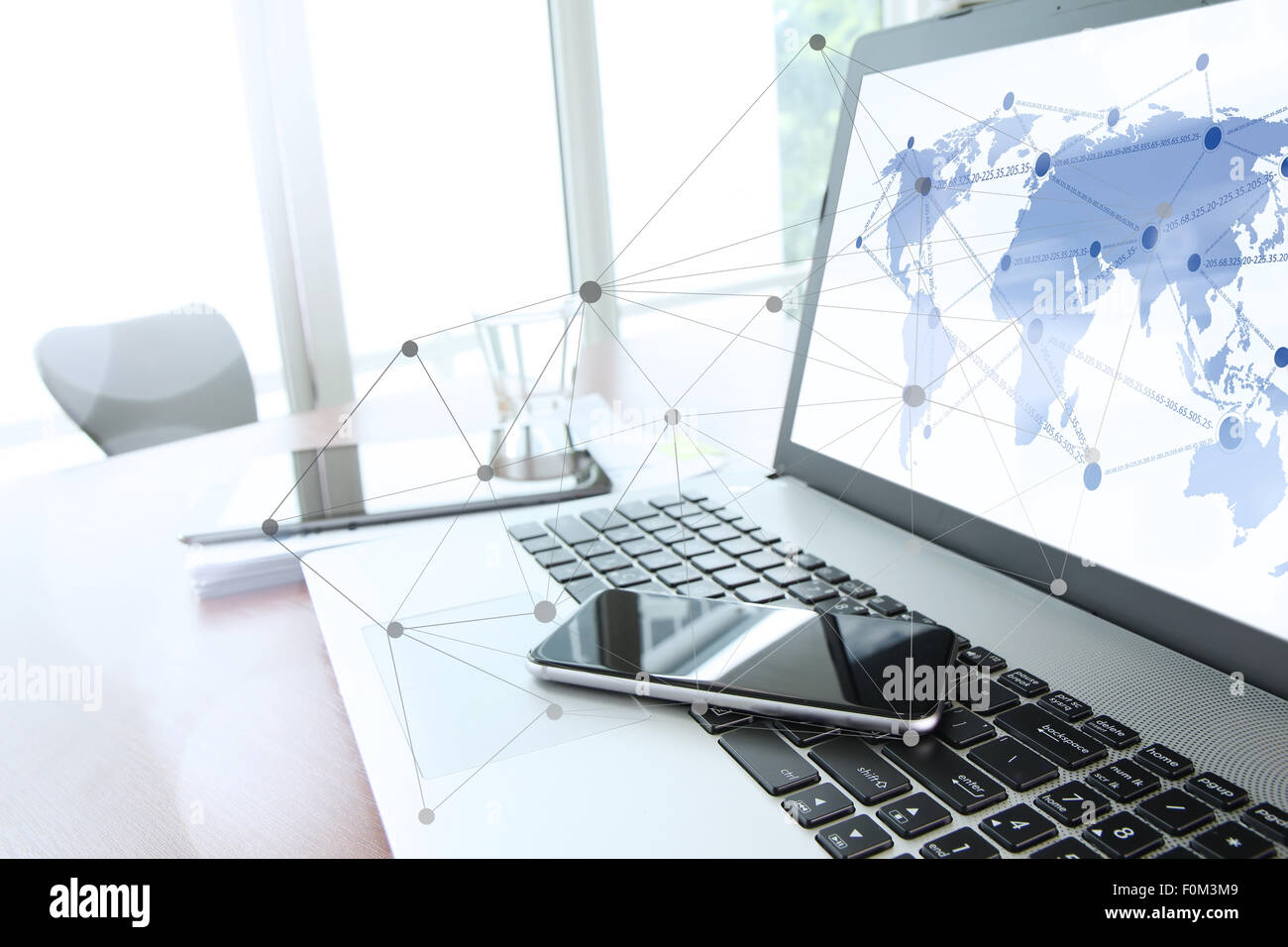 Office workplace with laptop computer and smart phone and stylus with ...