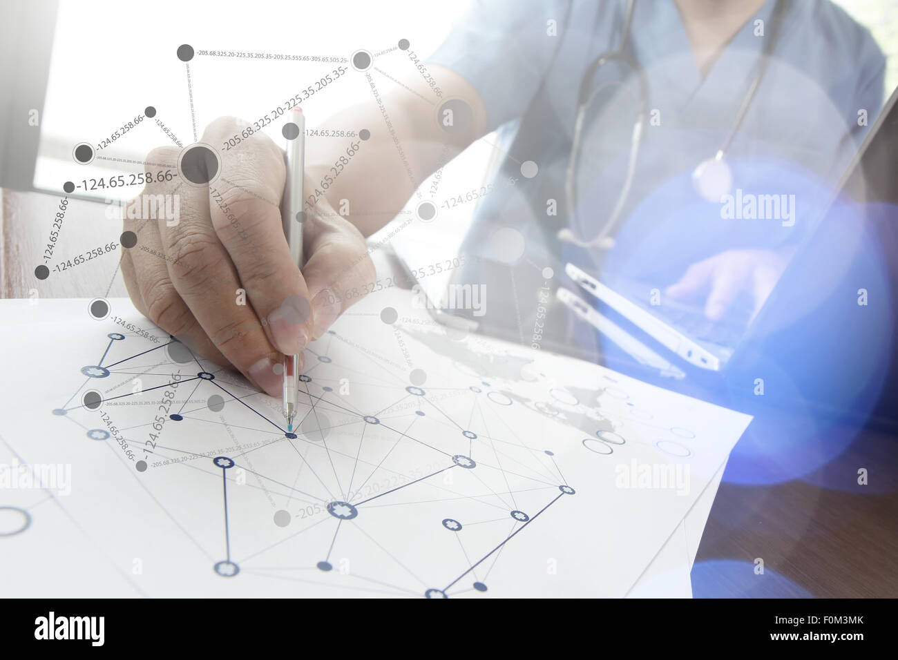 Doctor working with laptop computer in medical workspace office and ...