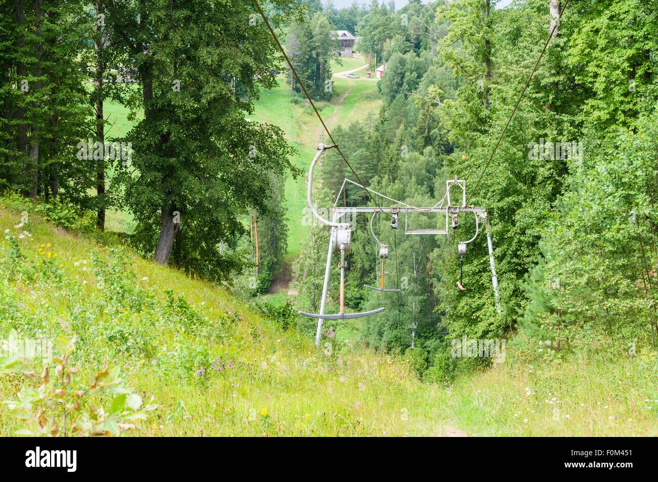 Inoperative rusty ski lift in woodland on summer Stock Photo - Alamy