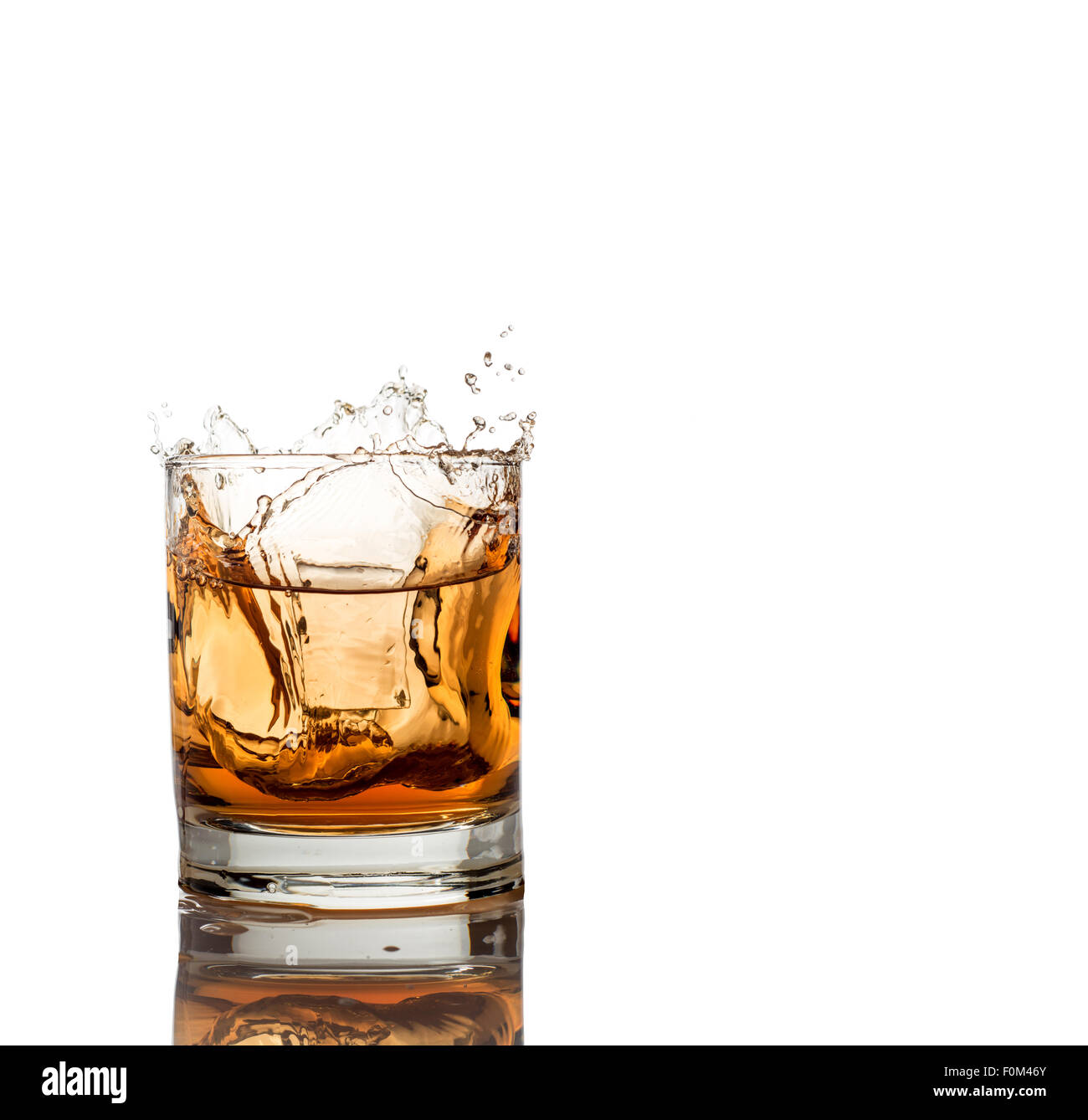 whisky splash isolated on a white background Stock Photo - Alamy