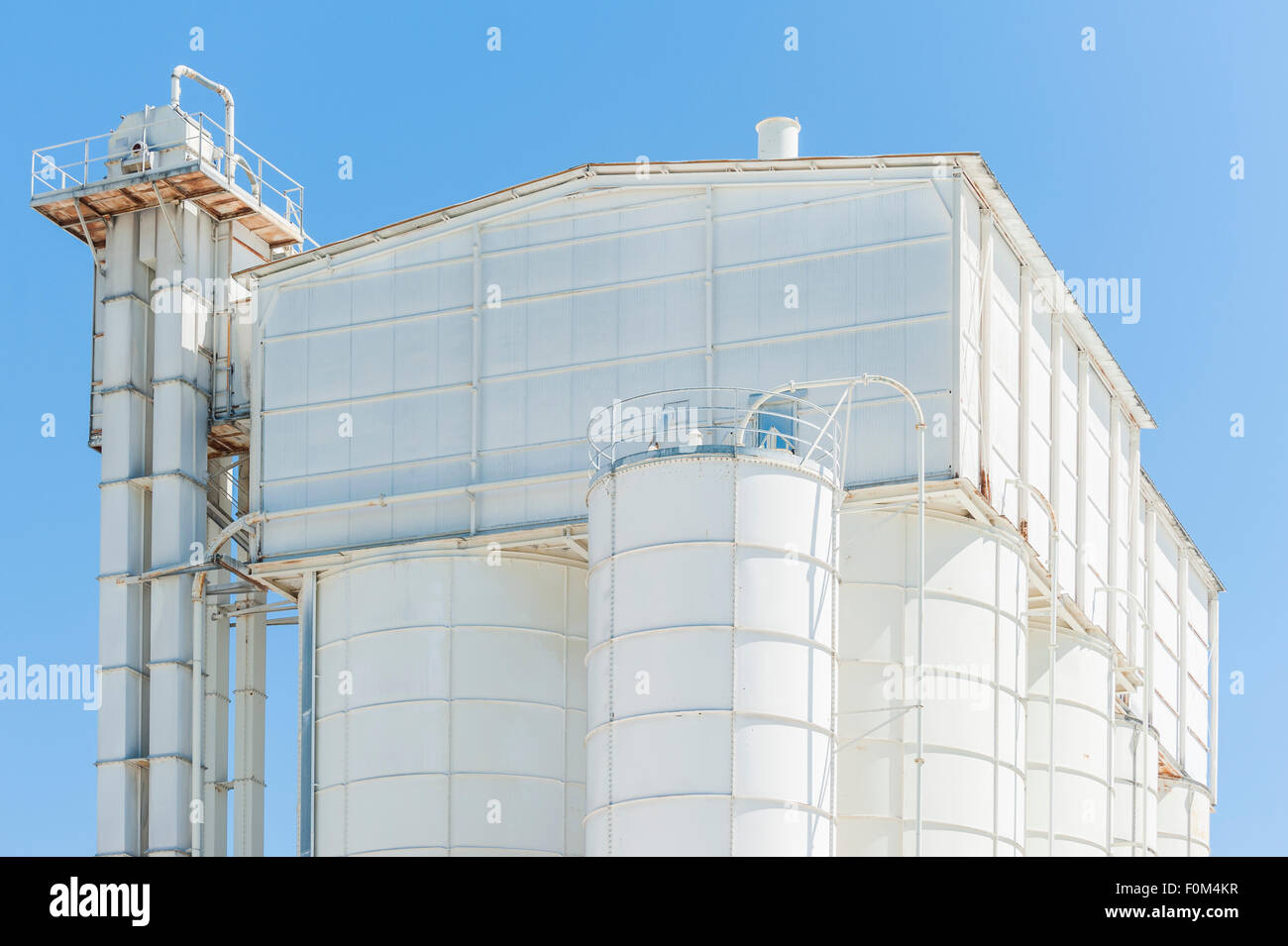 Old cement plant and storage silos Stock Photo - Alamy