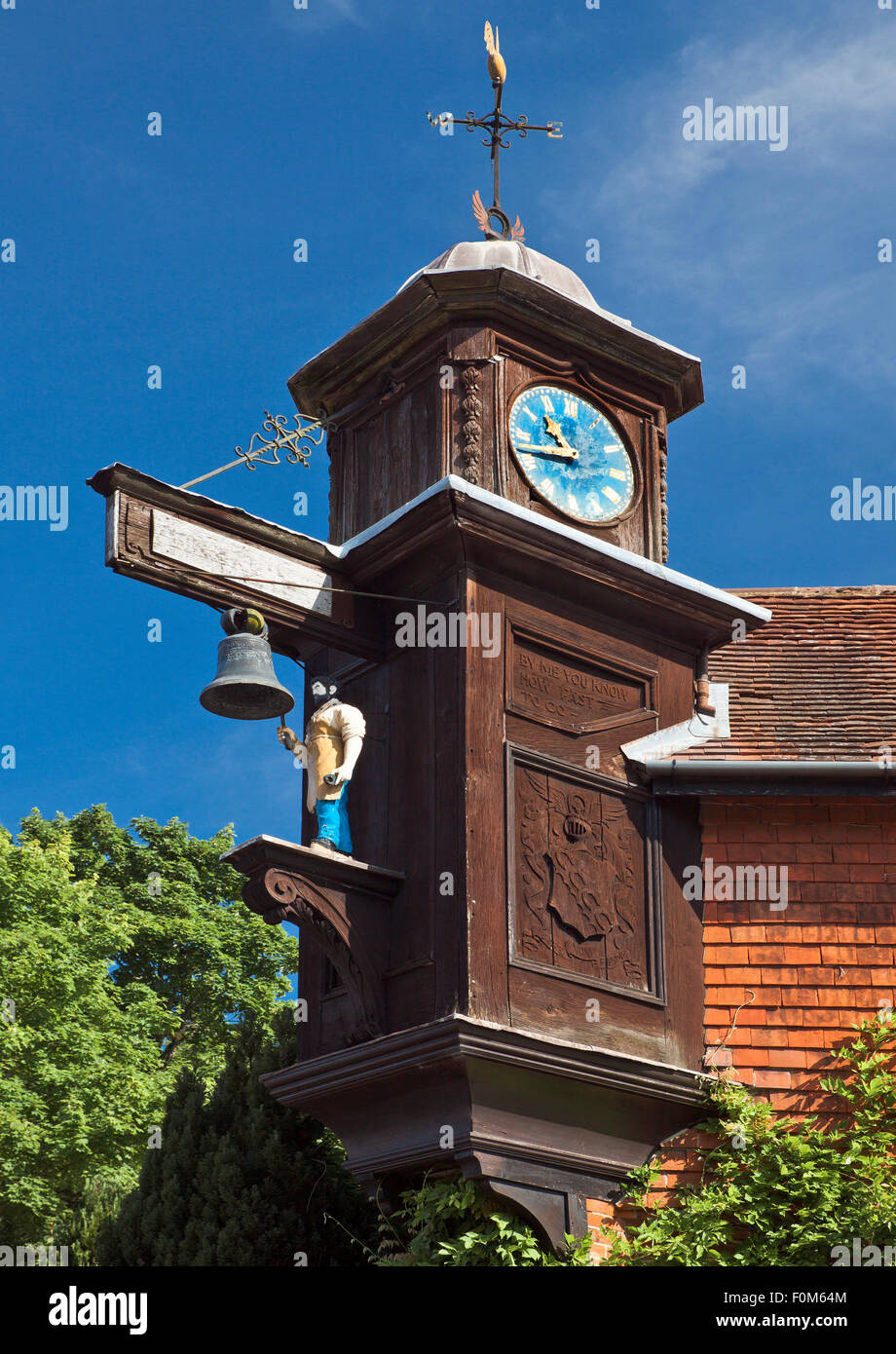 Abinger Hammer clock featuring Jack the Blacksmith Stock Photo - Alamy