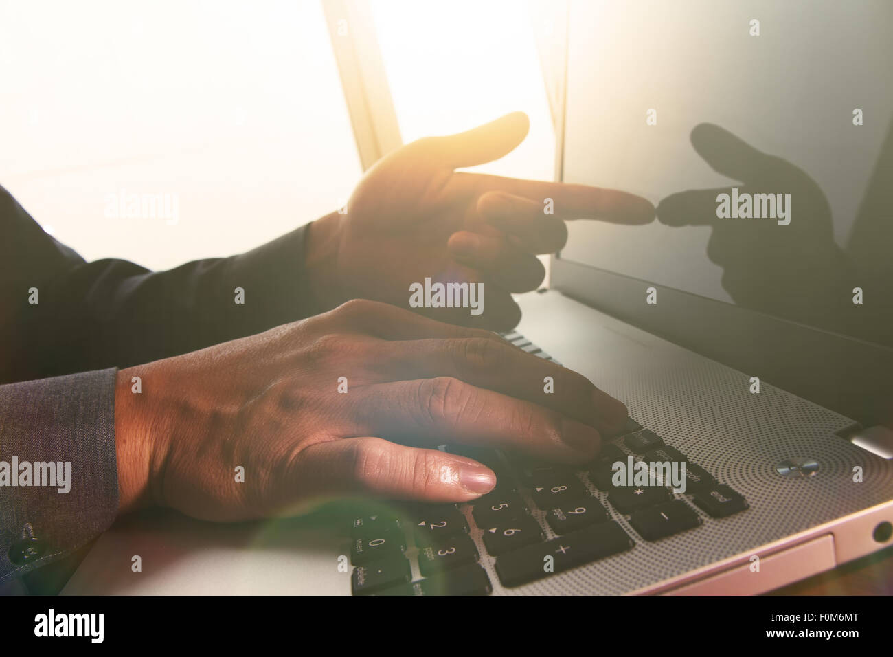 business man hand working with laptop computer and touching on screen ...