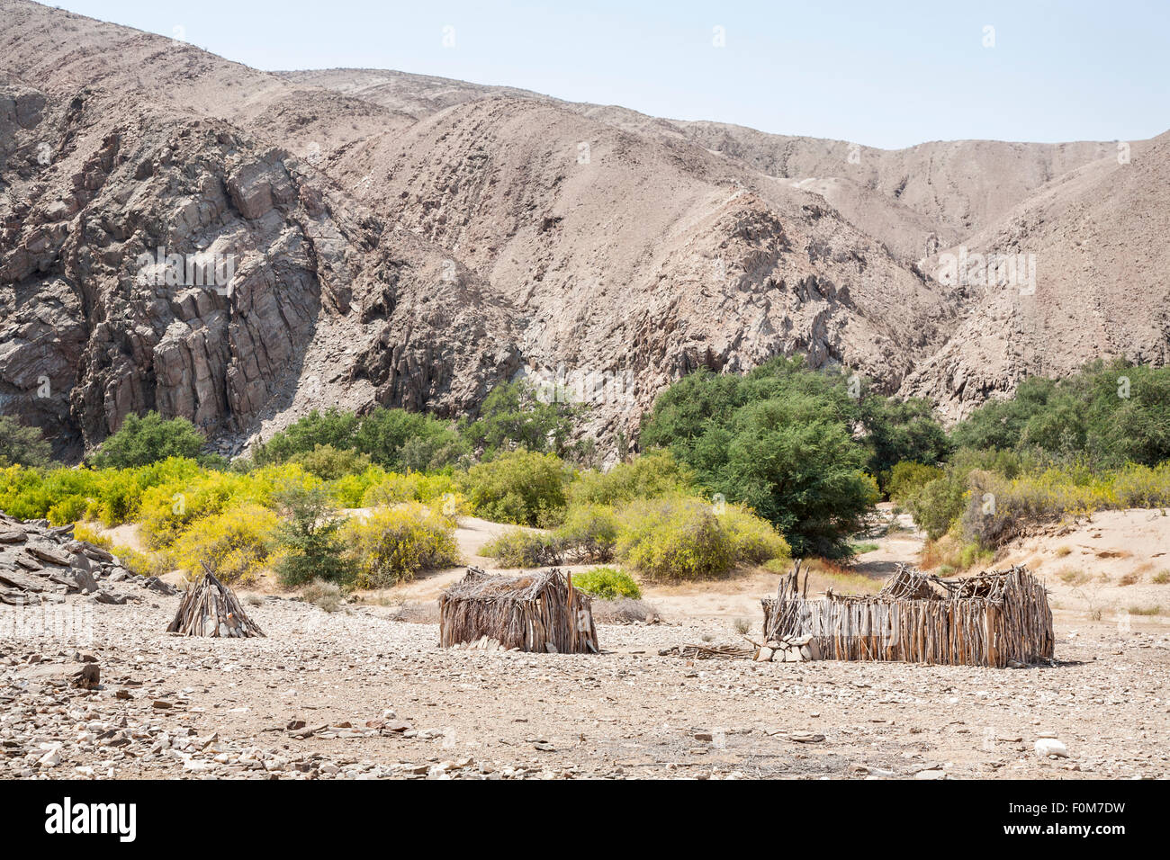 Angolan lifestyle and landscape: abandoned timber framed mud huts in ...