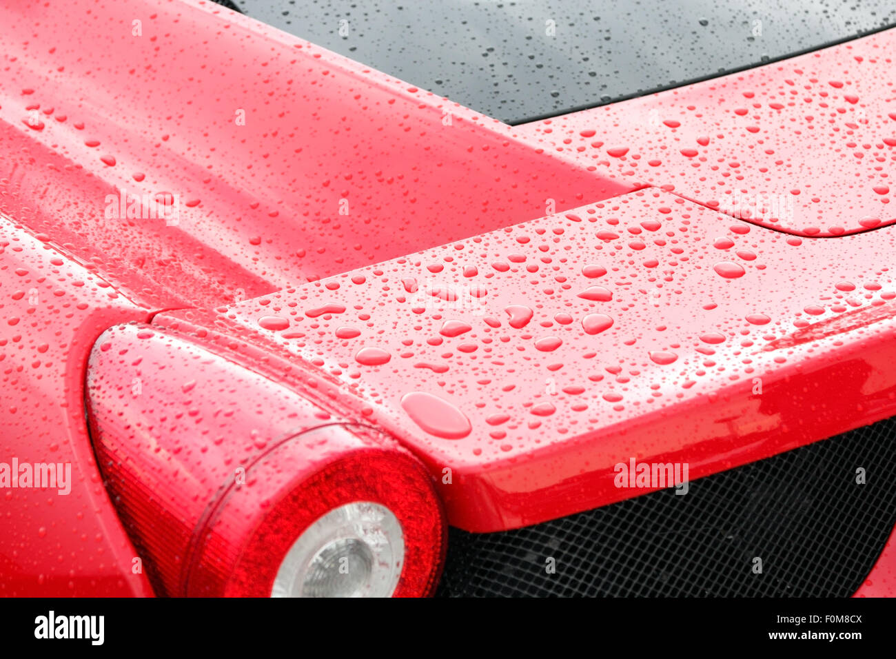 Rain drops on red car hi-res stock photography and images - Alamy
