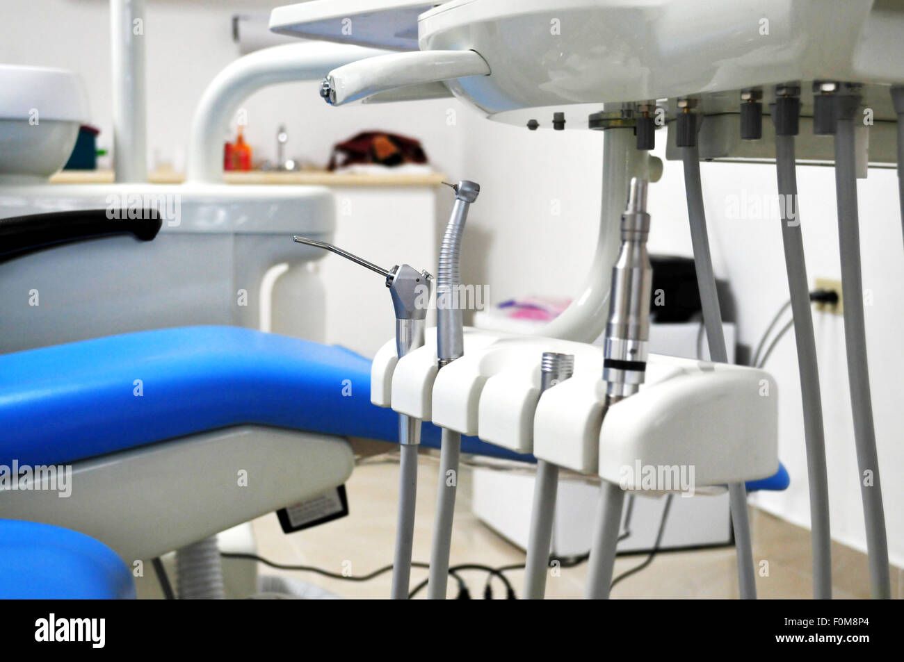 Close up shot inside a dental clinic showing the chair and part of the ...