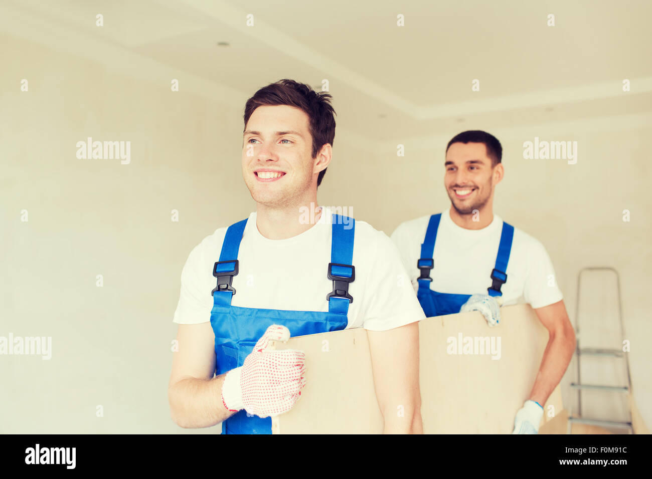 group of builders with wooden boards Stock Photo - Alamy