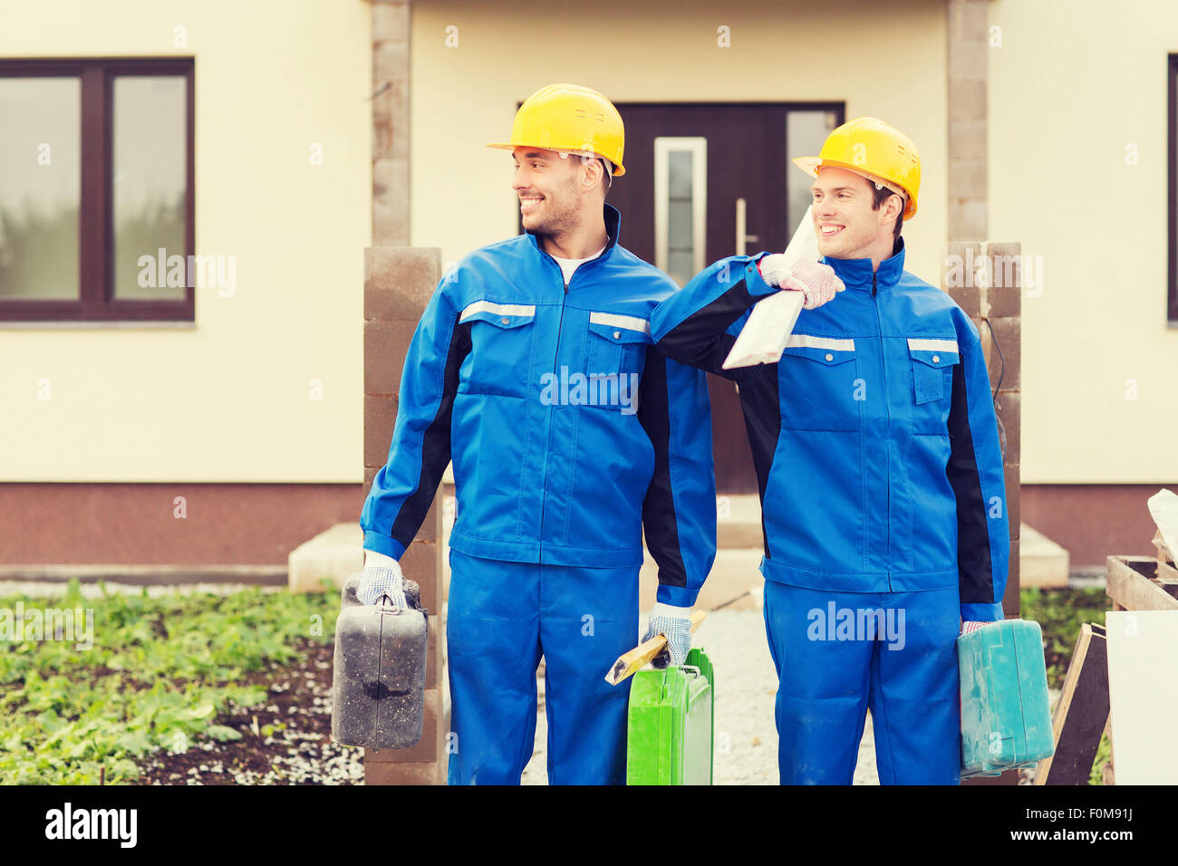 group of builders with toolboxes Stock Photo - Alamy