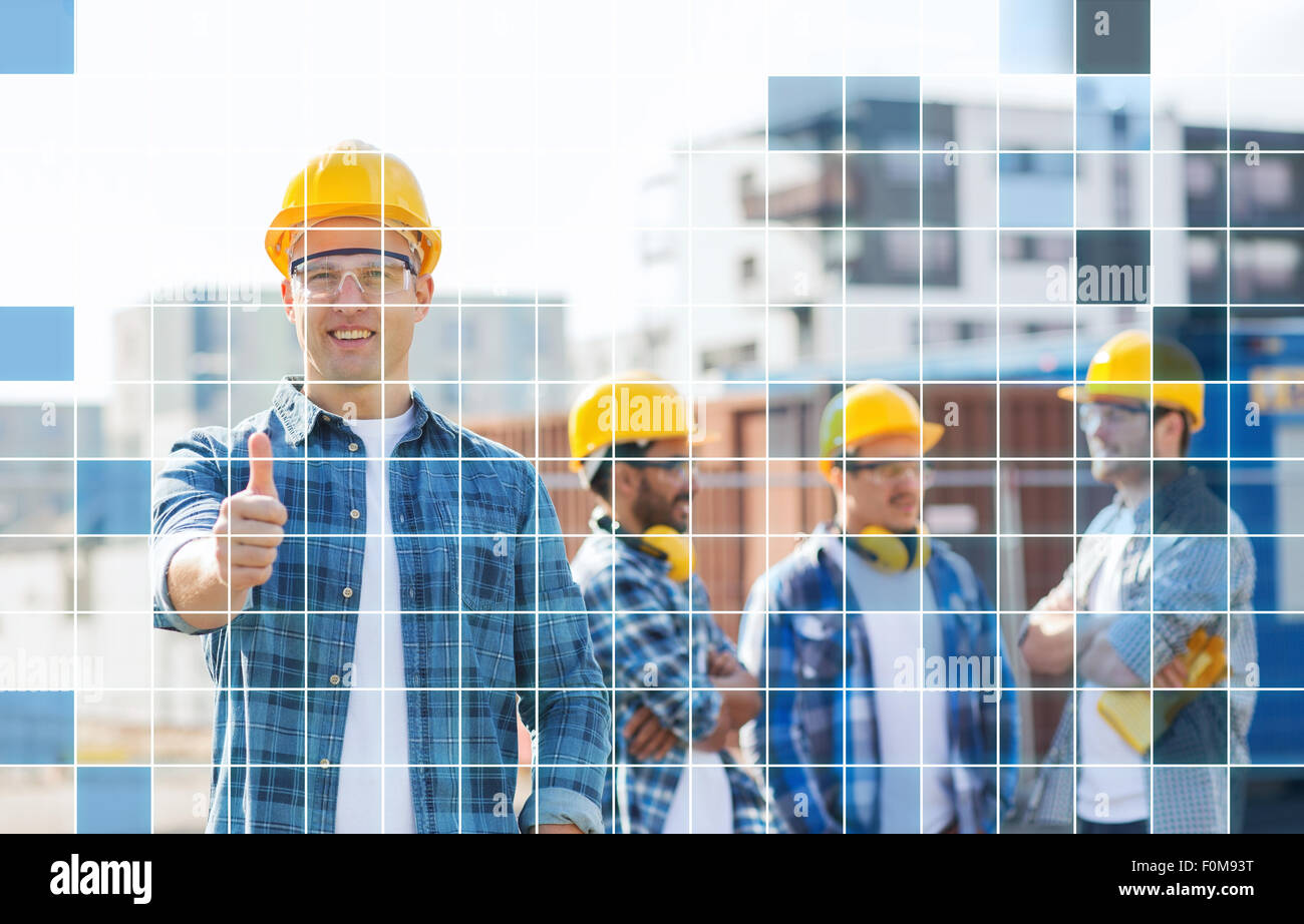 group of smiling builders in hardhats outdoors Stock Photo - Alamy