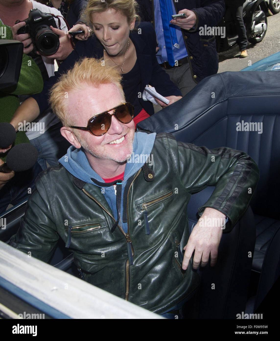 A very smiley Chris Evans leaves the BBC studios to head to Ascot races ...