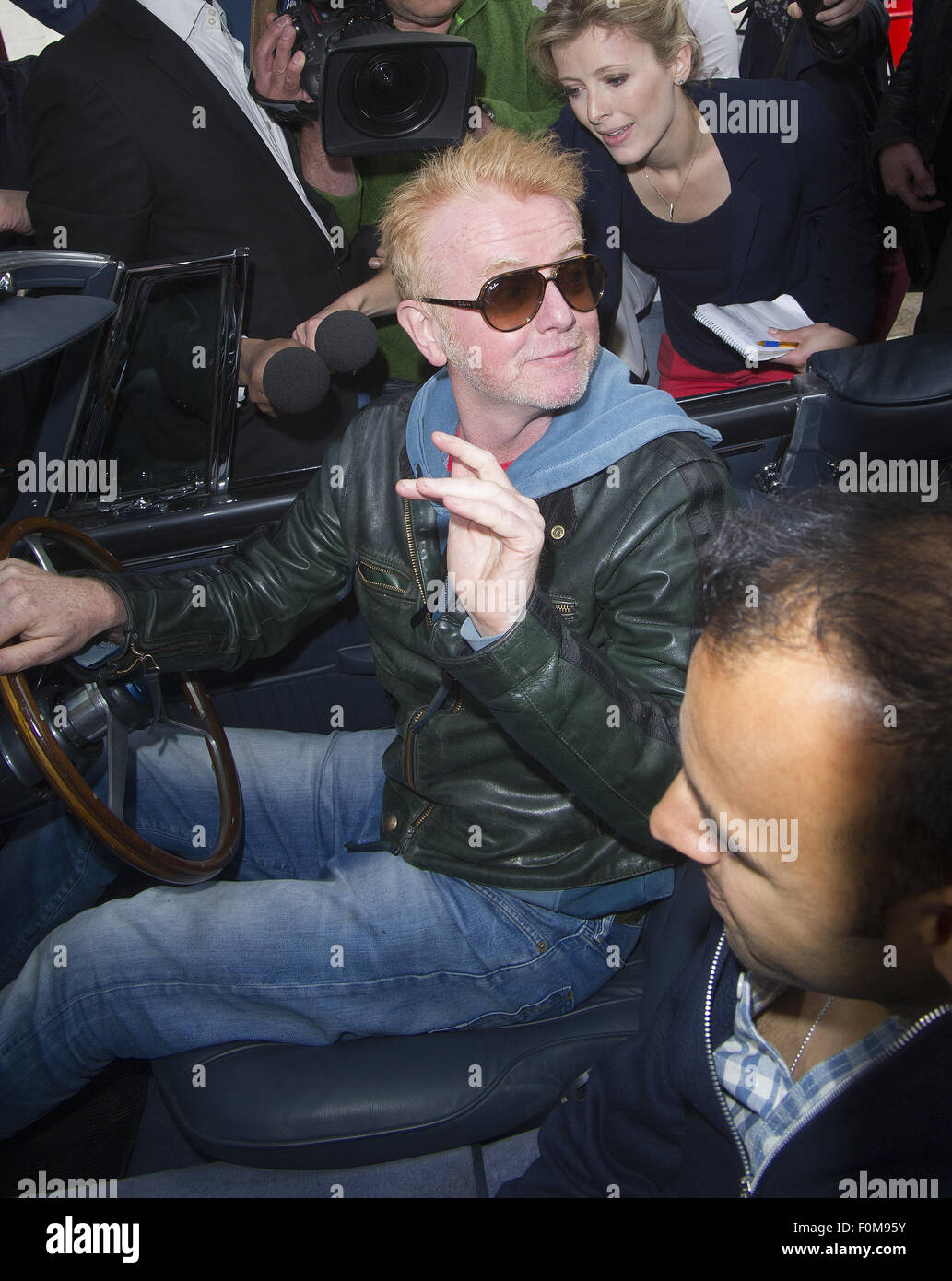 A very smiley Chris Evans leaves the BBC studios to head to Ascot races ...
