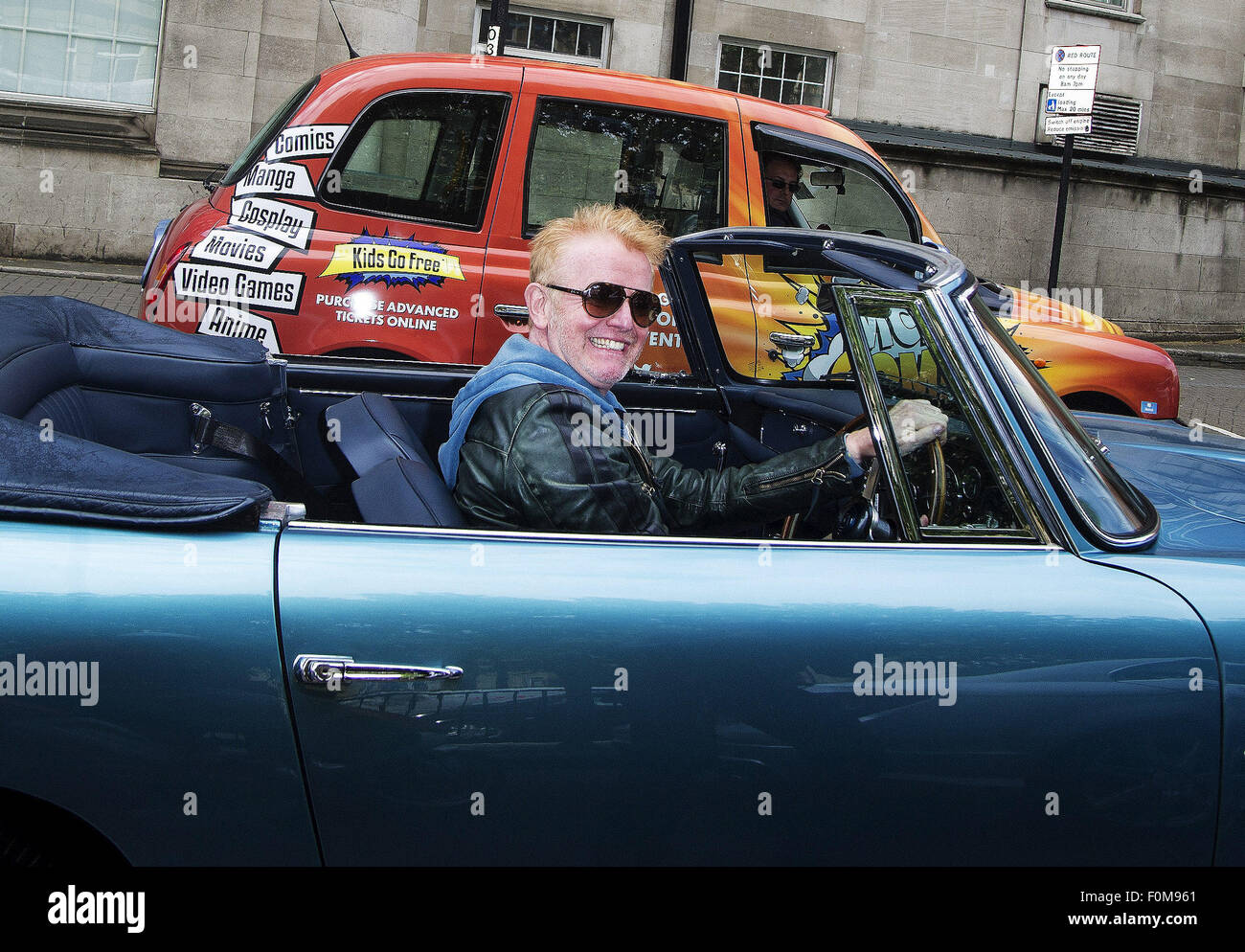 A very smiley Chris Evans leaves the BBC studios to head to Ascot races ...