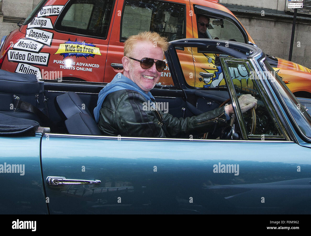 A very smiley Chris Evans leaves the BBC studios to head to Ascot races ...