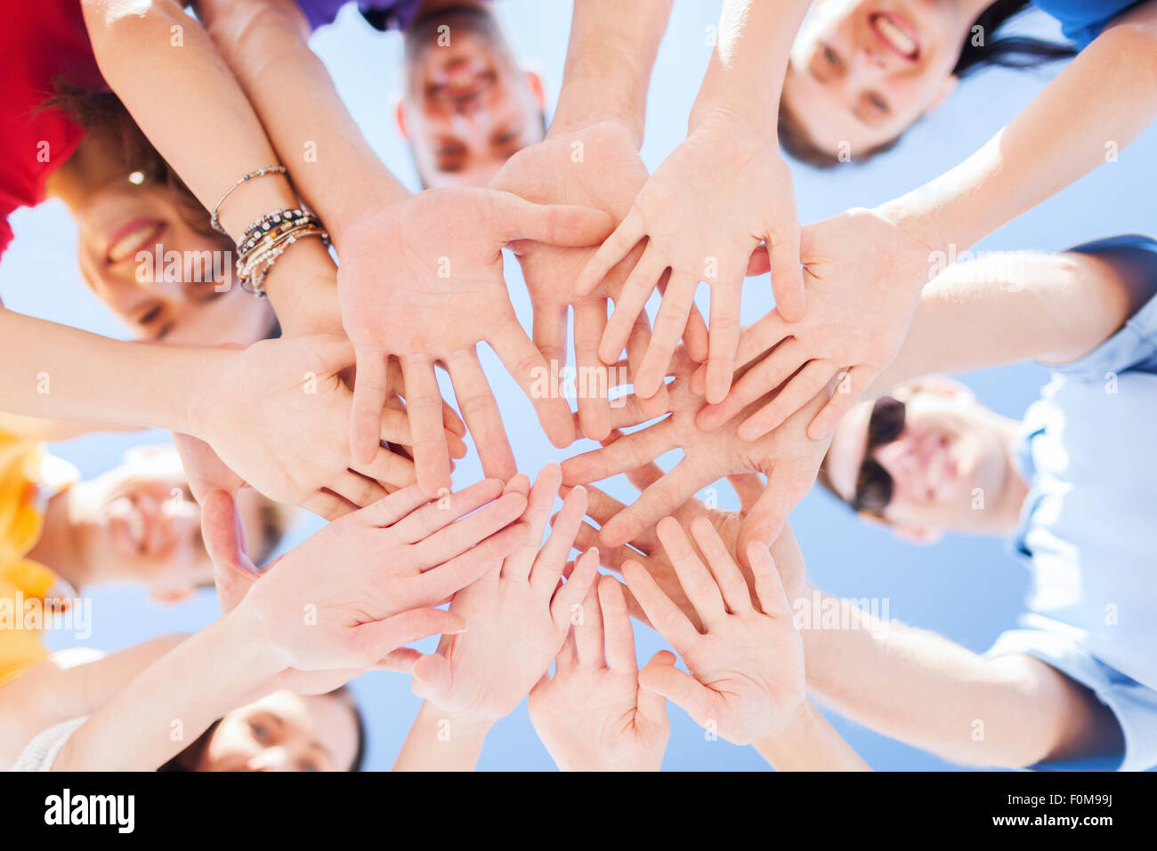 Many hands circle hi-res stock photography and images - Alamy