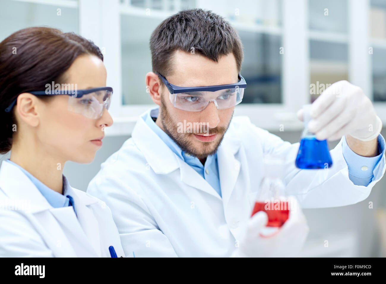 Young scientists showing teamwork hi-res stock photography and images ...