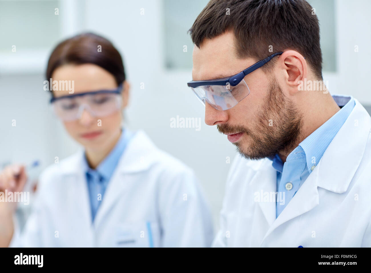 close up of young scientists at laboratory Stock Photo - Alamy