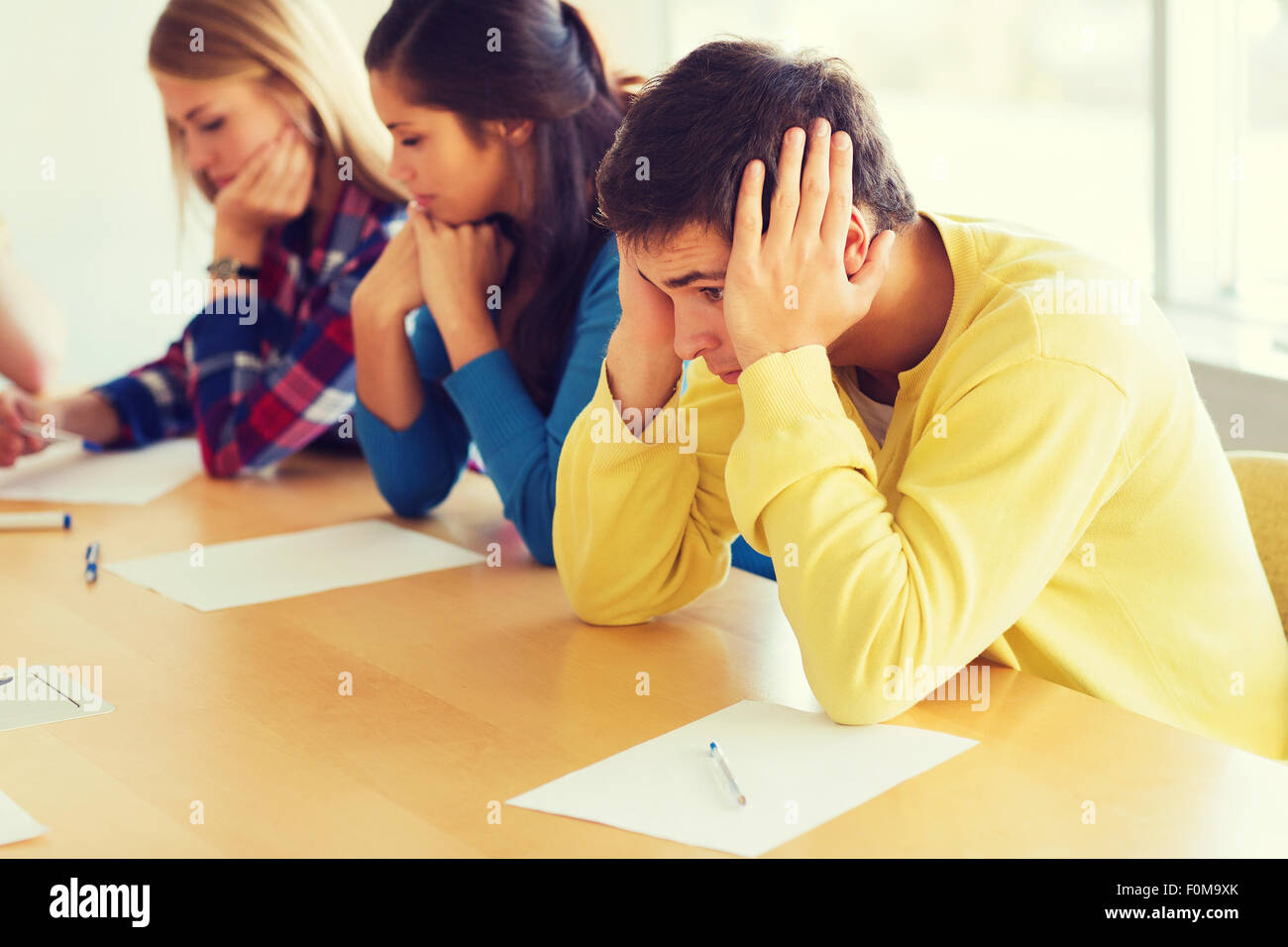 group of students with papers Stock Photo - Alamy