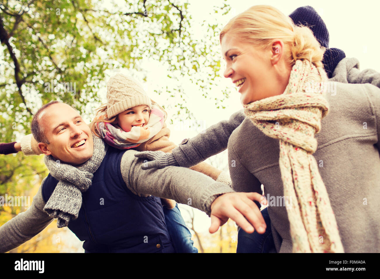 happy family having fun in autumn park Stock Photo - Alamy
