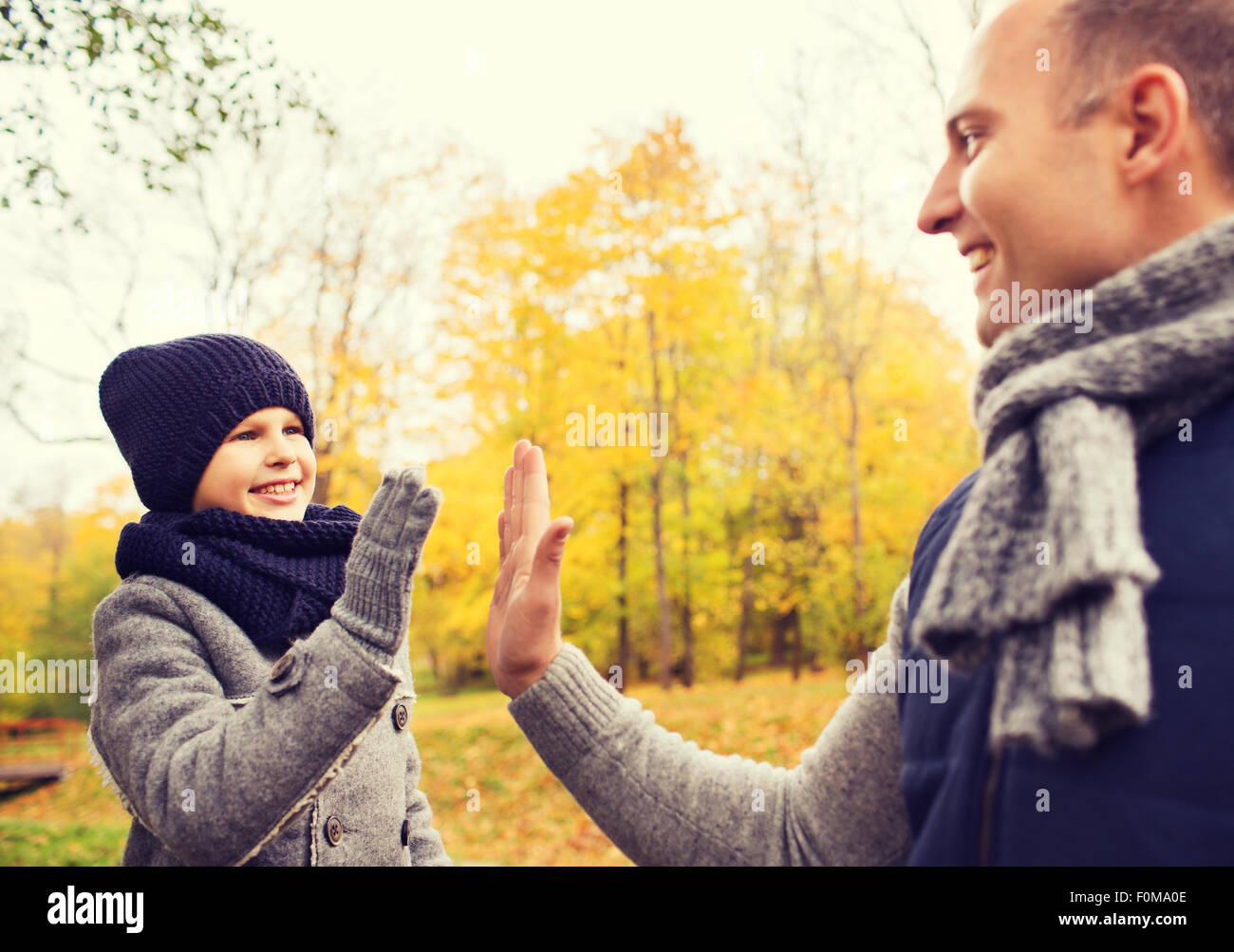 happy father and son making high five in park Stock Photo - Alamy