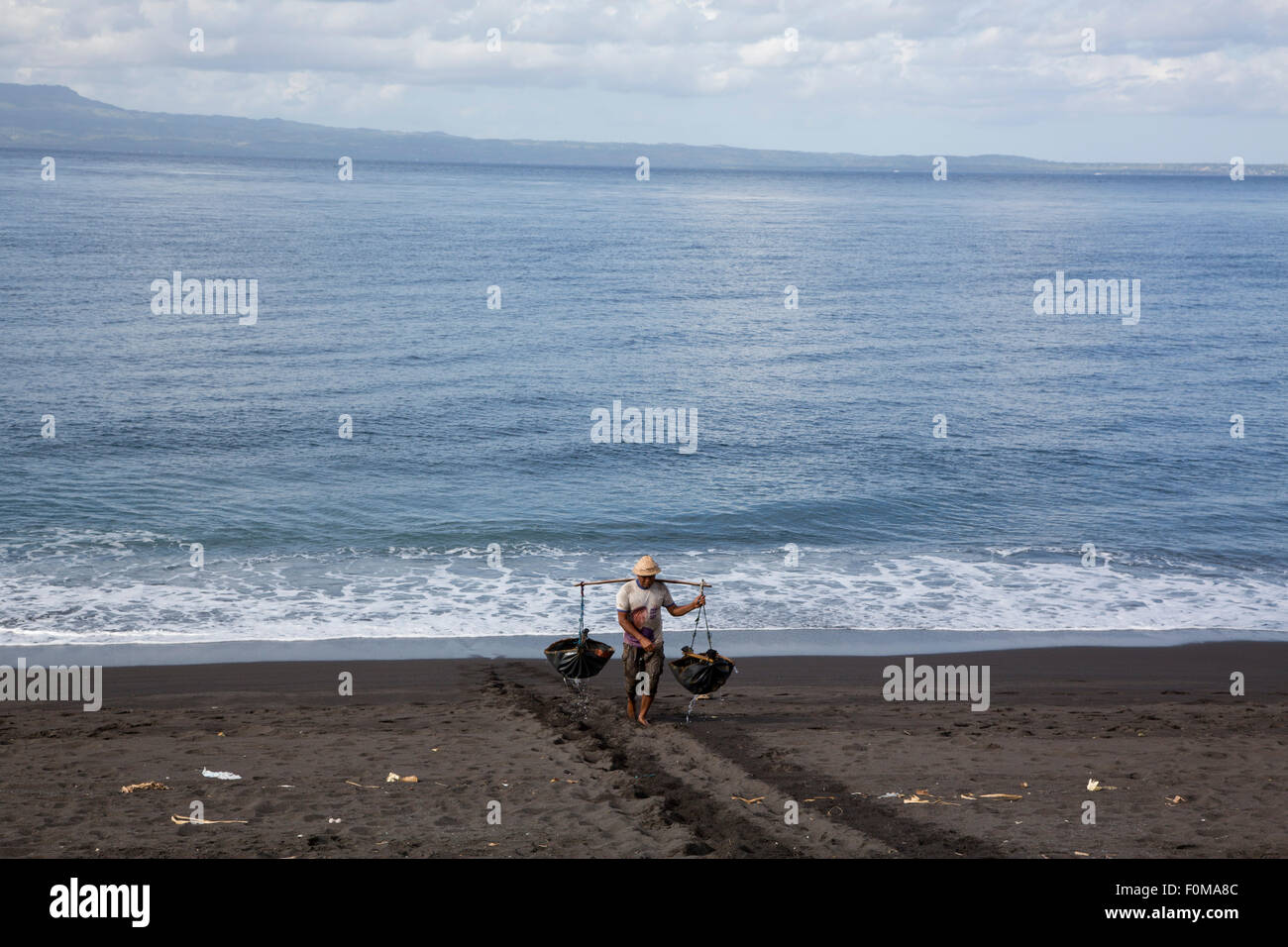 Traditional salt making in Kusamba Bali Stock Photo - Alamy
