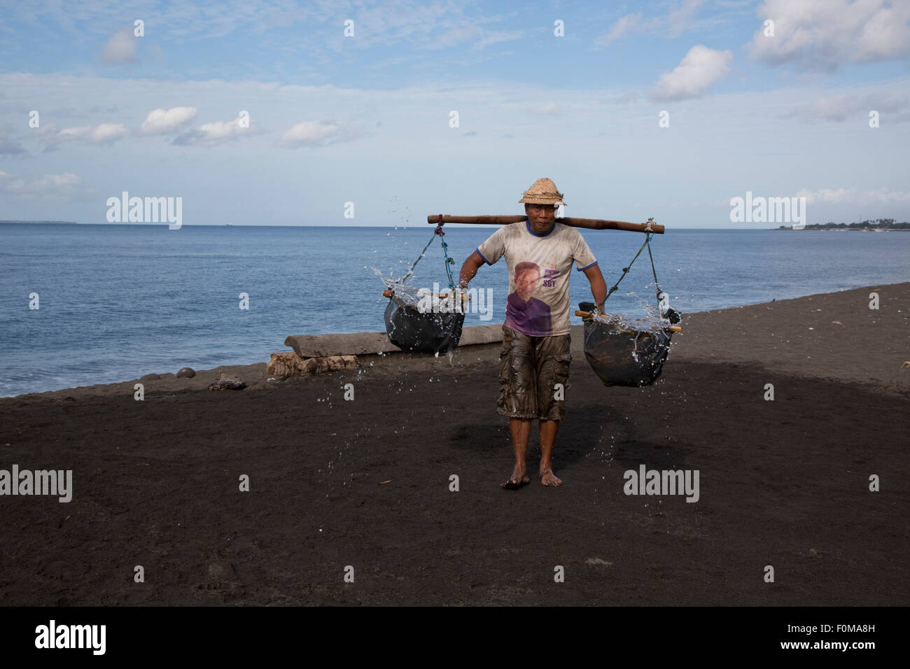 Traditional salt making in Kusamba Bali Stock Photo - Alamy
