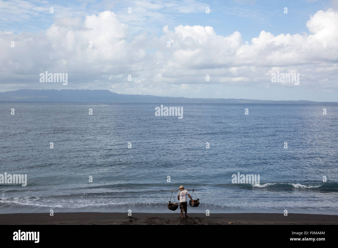 Traditional salt making in Kusamba Bali Stock Photo - Alamy