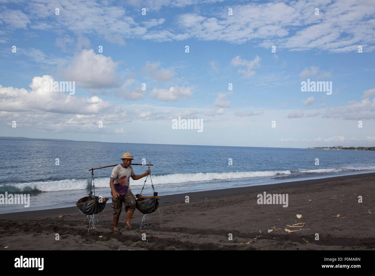 Traditional salt making in Kusamba Bali Stock Photo - Alamy