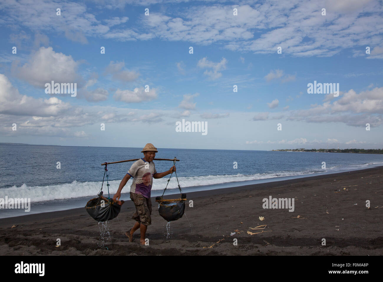 Traditional salt making in Kusamba Bali Stock Photo - Alamy