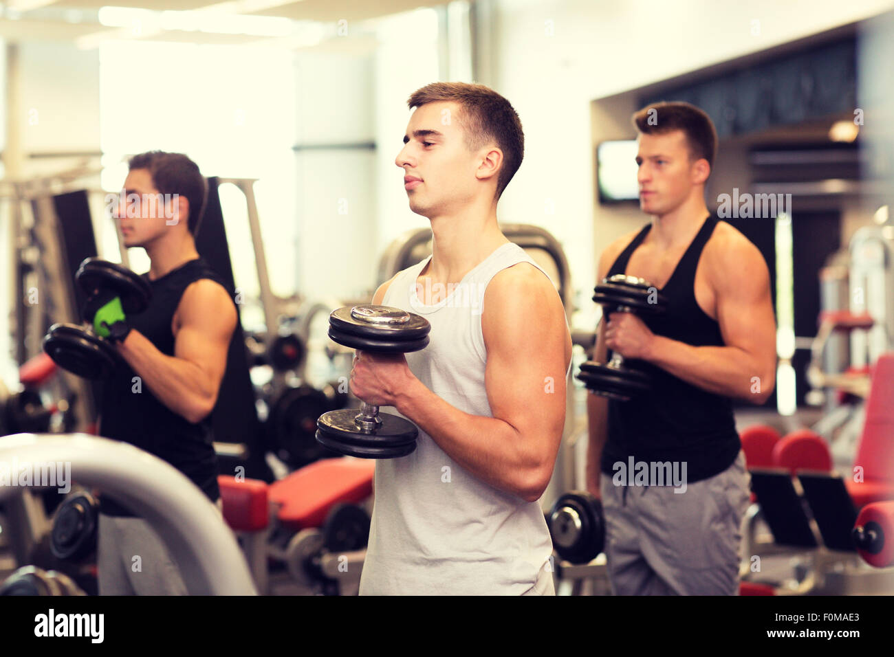 Group men working dumbbells gym hi-res stock photography and images - Alamy